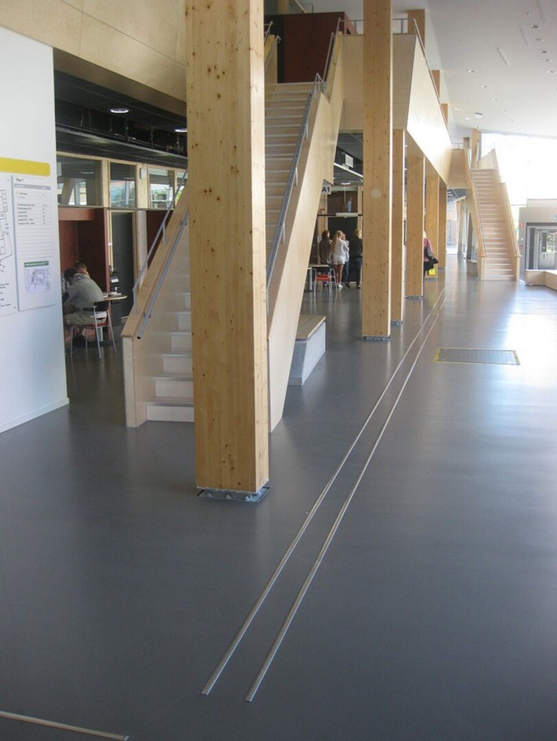 Underlayment and decorative floor in university building